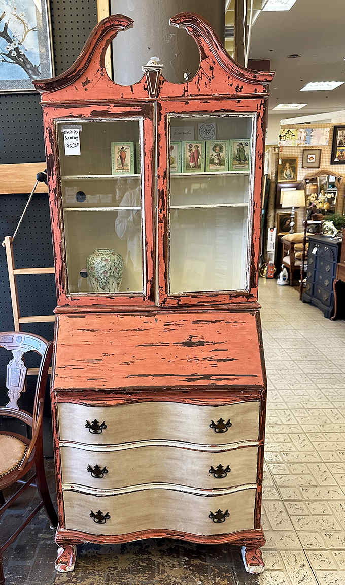 This coral-hued secretary desk has lived more lives than a cat&mdash;from elegant parlor piece to shabby chic statement maker.