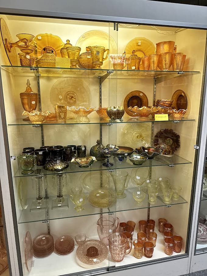 Carnival glass glowing like liquid sunshine, each piece catching light like it's showing off deliberately.