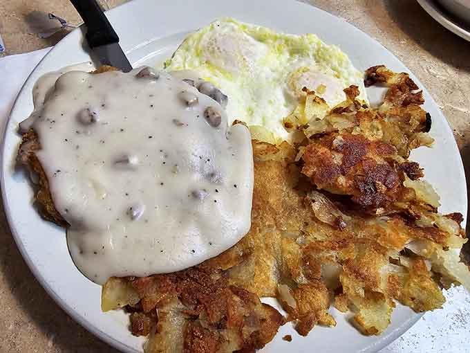 Chicken fried steak with hash browns and eggs: comfort food that sticks to your ribs wonderfully.