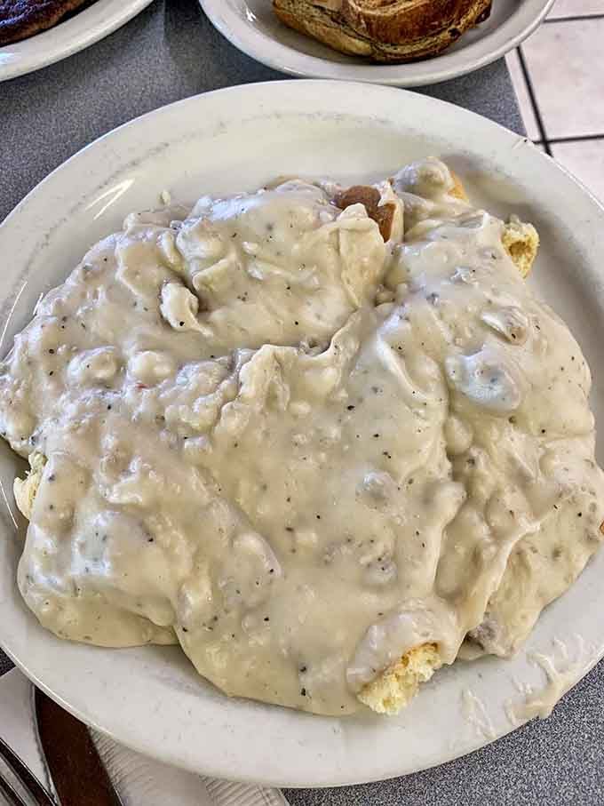 Biscuits and gravy so generous they're practically spilling over the plate's edge&mdash;comfort food that hugs you from the inside out.