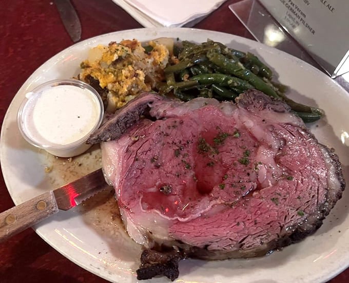 Perfectly cooked prime rib with that ideal pink center, proving small-town taverns can absolutely nail fine dining standards every time.