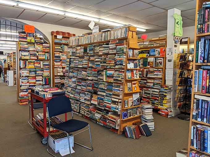 That rolling cart loaded with books is basically a mobile treasure chest waiting to reveal its literary secrets to curious browsers.