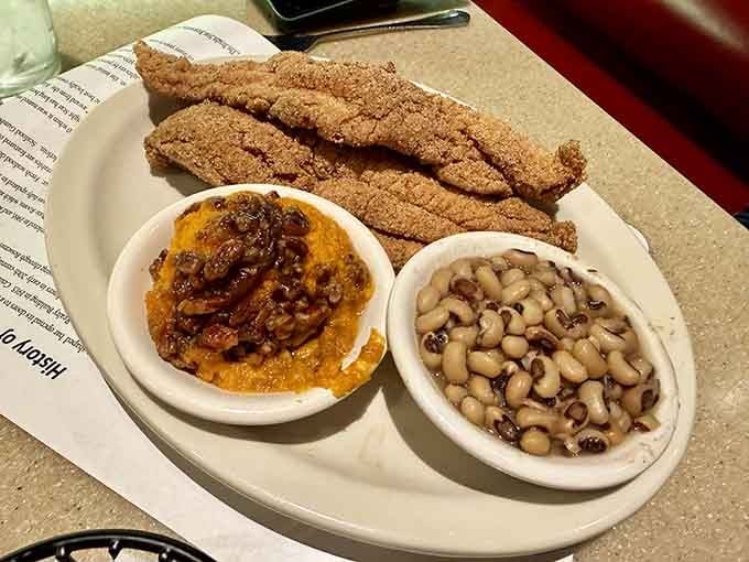 Golden catfish strips paired with black-eyed peas and sweet potato casserole is comfort food speaking fluent Southern.