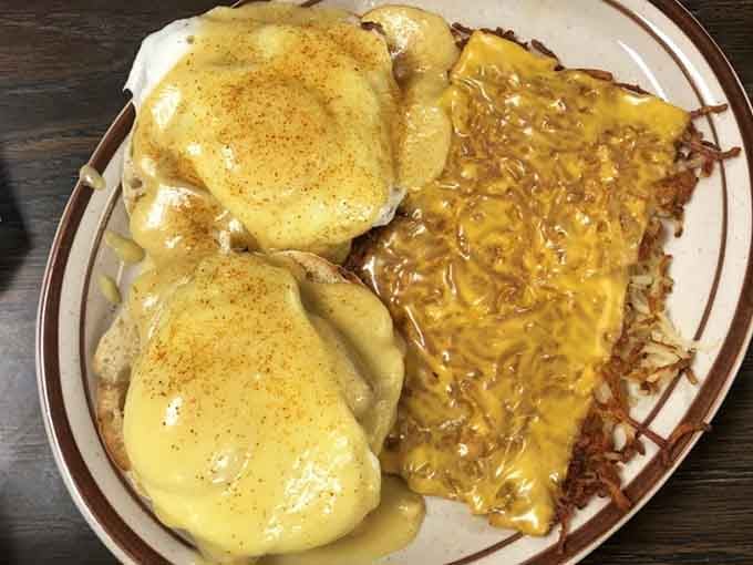 Eggs Benedict with hash browns covered in cheese sauce, because sometimes you need breakfast to give you a hug.
