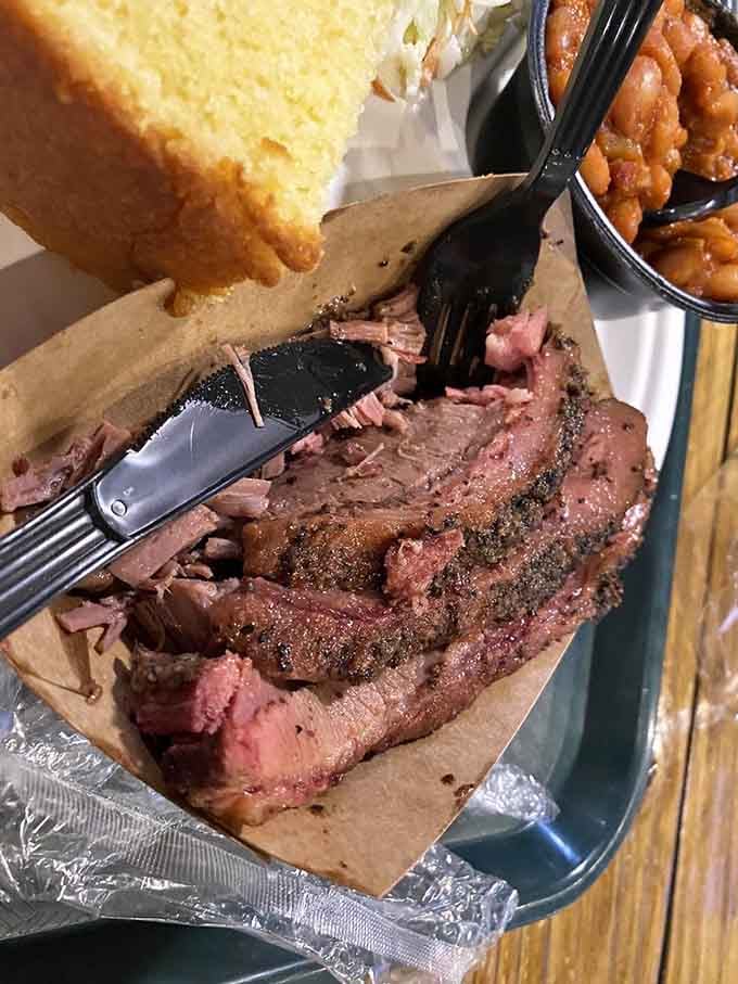 Brisket so tender it practically surrenders to your fork. That smoke ring is like nature's way of saying "patience pays off" – low and slow is the only way to go.