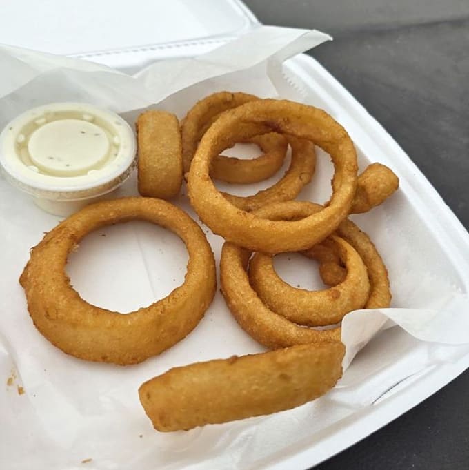 Onion rings so perfectly golden and crispy, they could make a grown person weep with joy.