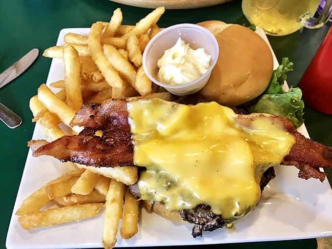 This isn't just a burger; it's a masterclass in melted cheese architecture, with bacon playing a supporting role worthy of its own Oscar.