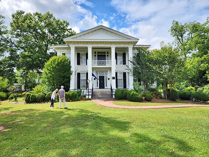The Burt-Stark Mansion's stately white columns and wraparound porch practically whisper "come sit a spell" in the most elegant Southern accent imaginable.