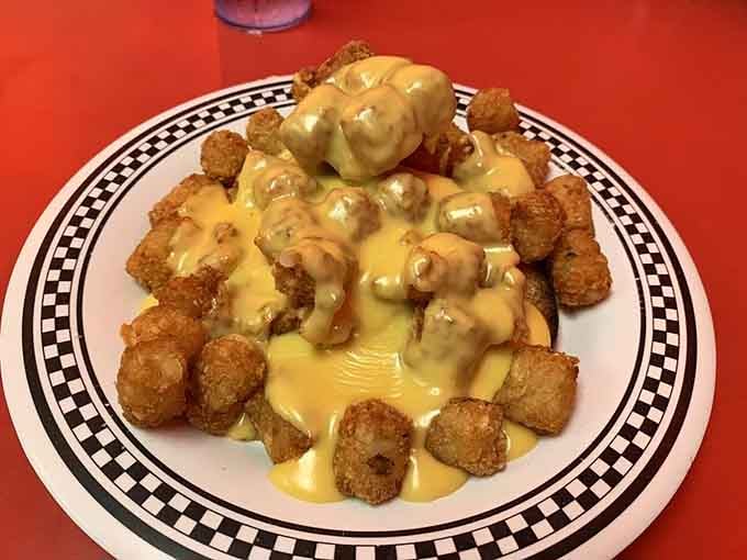 The chicken breast horseshoe with tater tots and cheese sauce, defying gravity and dinner plate engineering since forever.