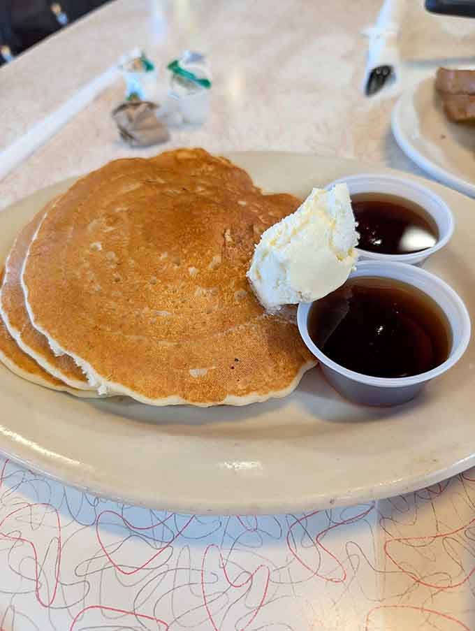 Pancakes this fluffy deserve their own zip code, served with butter and syrup like nature intended.