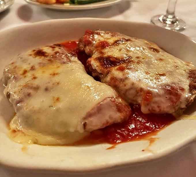 Chicken parmigiana that would make your Italian grandmother weep with joy &ndash; crispy, tender, and smothered in a sauce that's been perfected over decades.
