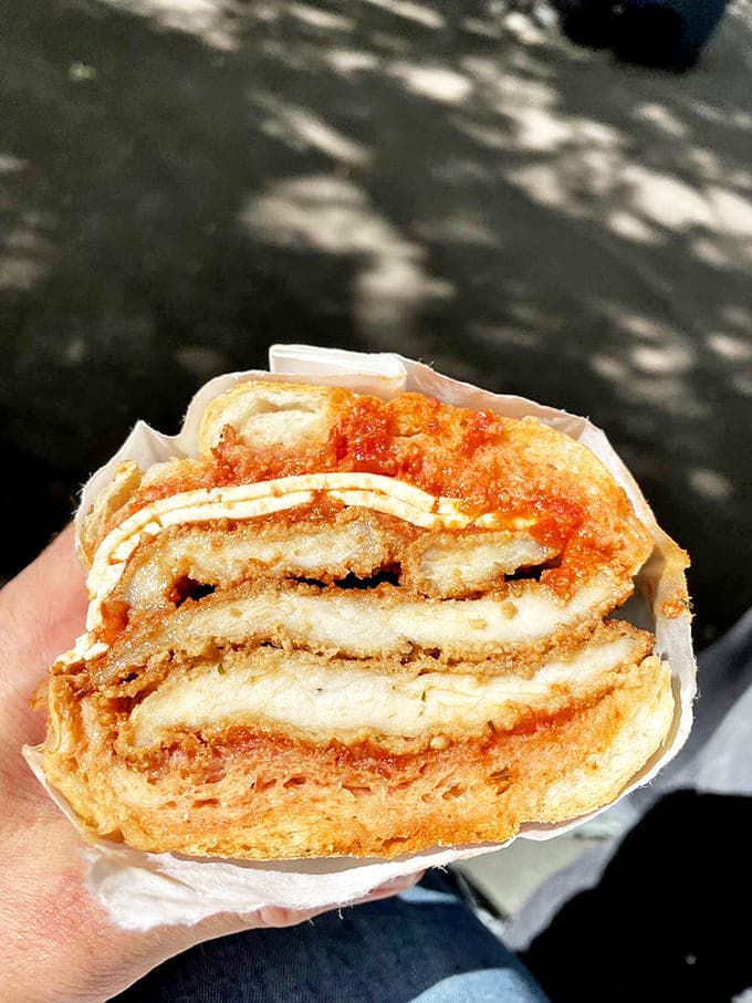 This chicken cutlet sandwich isn't just lunch&mdash;it's edible therapy, with each crispy, saucy, cheesy bite dissolving the day's stress faster than your therapist ever could.