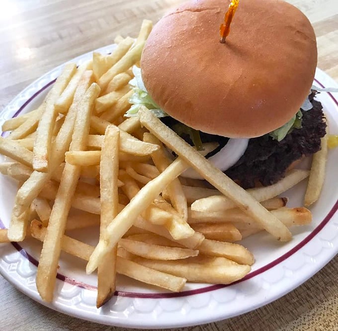 Sometimes simplicity wins: a perfectly cooked burger with crispy fries is all you need.