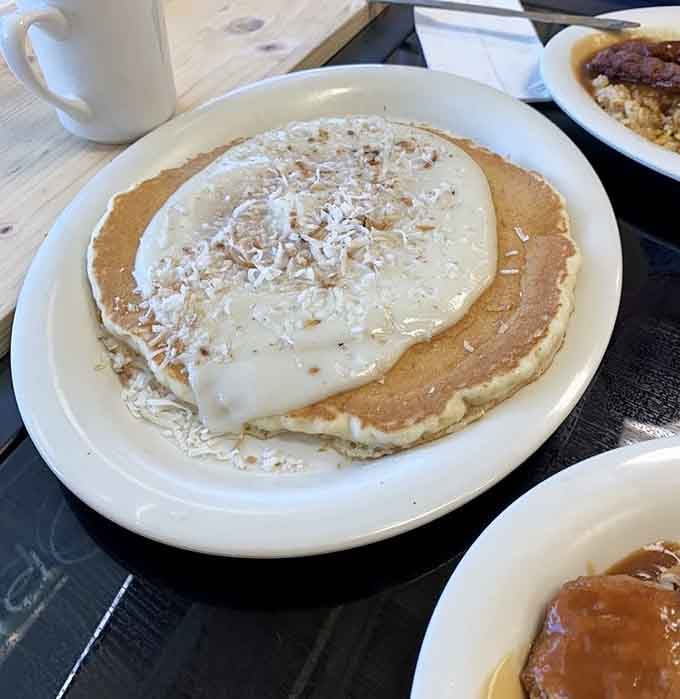 Not just a pancake, but a fluffy island of deliciousness topped with coconut shavings &ndash; the breakfast equivalent of finding an extra day in your vacation.