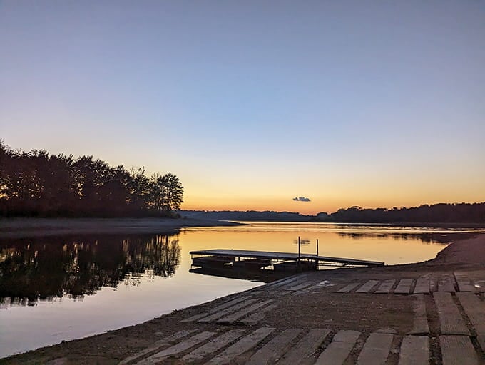 Dawn breaks over the boat launch, painting the sky in colors your TV can't replicate.