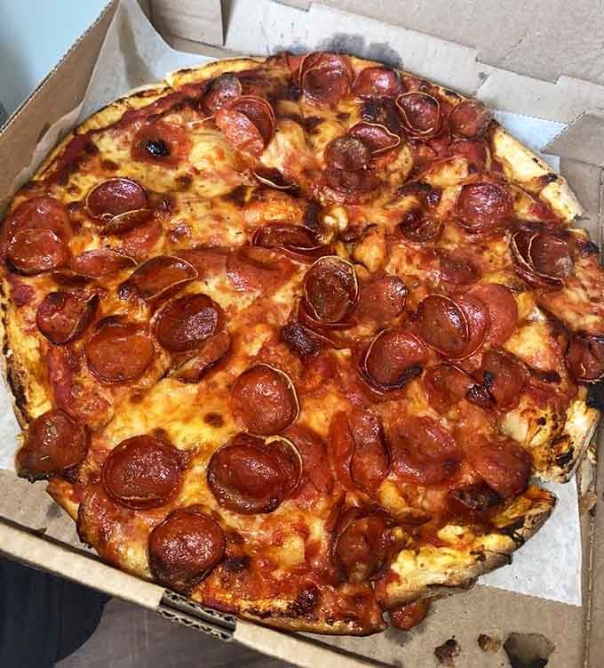 Pepperoni cups up like little grease-catching vessels of joy, delivering flavor in every single bite you take.