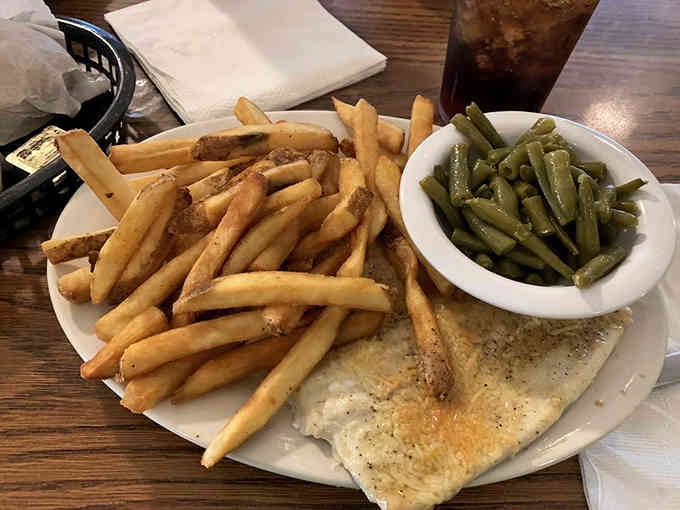 Parmesan-crusted trout proves this mountain cafe knows its way around seafood too, surprisingly well.