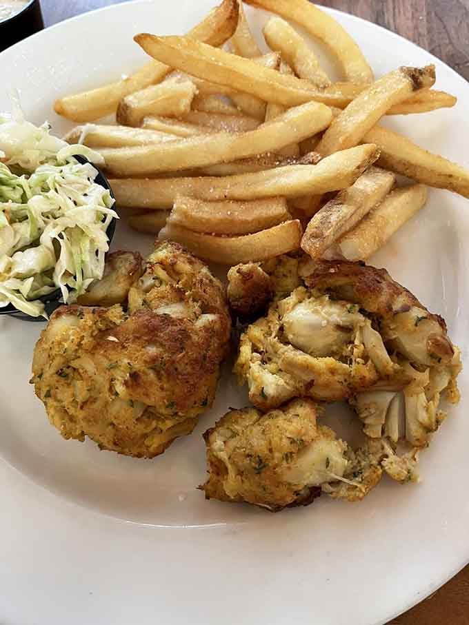 Maryland crab cakes done right&mdash;mostly crab, minimal filler, and cooked to golden perfection. The kind that make out-of-towners finally understand what the fuss is about.