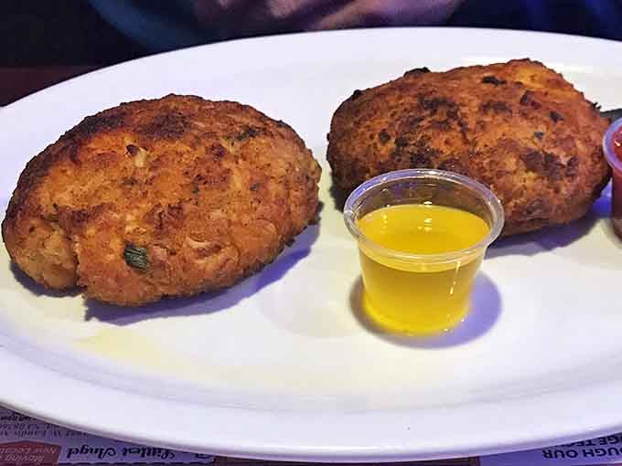 These golden-brown crab cakes aren't those sad, breadcrumb-heavy imposters. They're the real deal&mdash;chunky, seasoned, and ready for their melted butter bath.