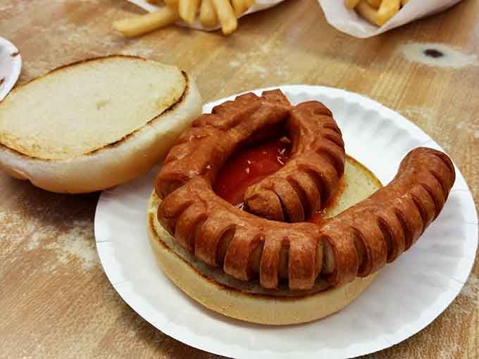 The Curly Q Dog looks like a hot dog that went to finishing school and came back with architectural ambitions.