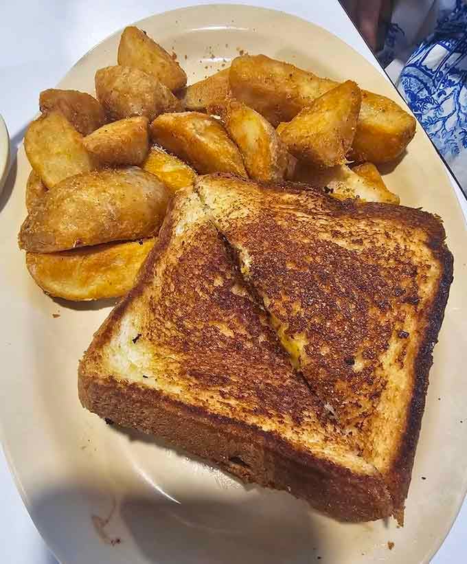 Grilled cheese done right with crispy edges and potato wedges that would make your grandmother proud.