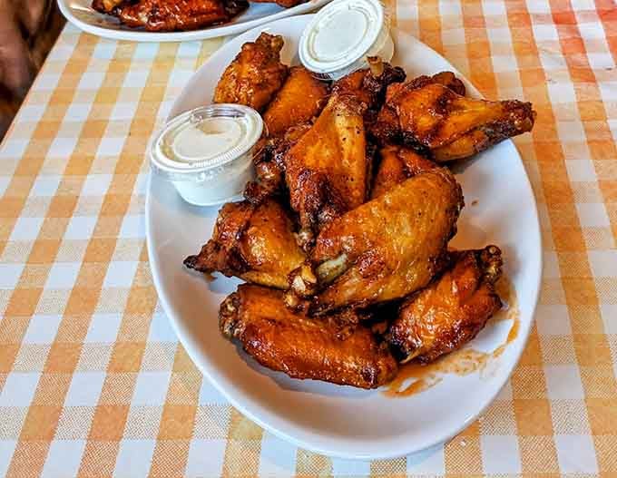 Wings so perfectly glazed they could make a vegetarian pause and reconsider their entire life philosophy momentarily.
