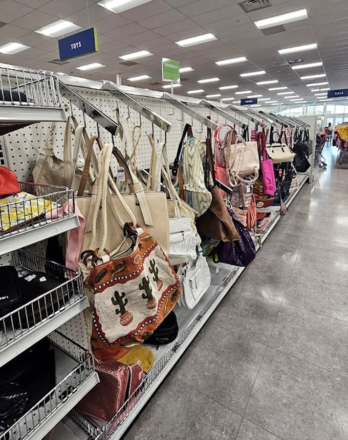 Bags line up like fashion soldiers, each one carrying stories from someone else's shopping sprees past.