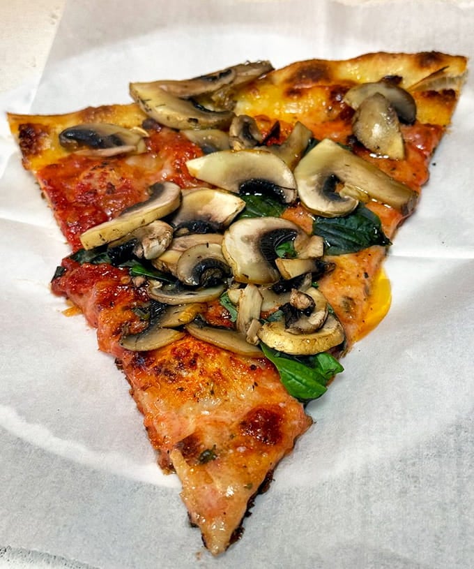 Mushrooms piled high prove that fungi never looked this good, nestled in melted cheese like nature's perfect topping.