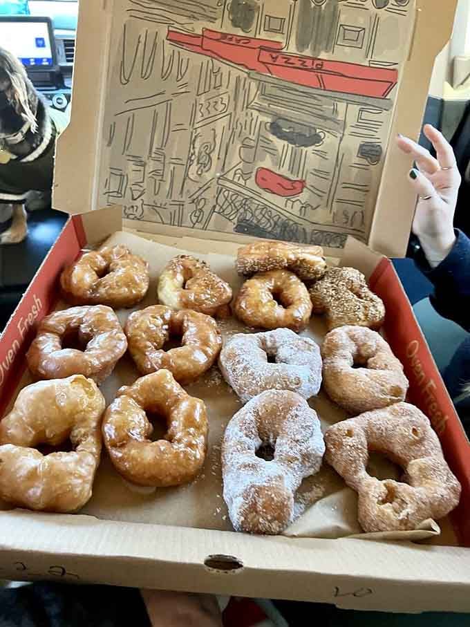 Fresh doughnuts arranged like edible art, proving that sometimes the simple pleasures are the most spectacular ones around.