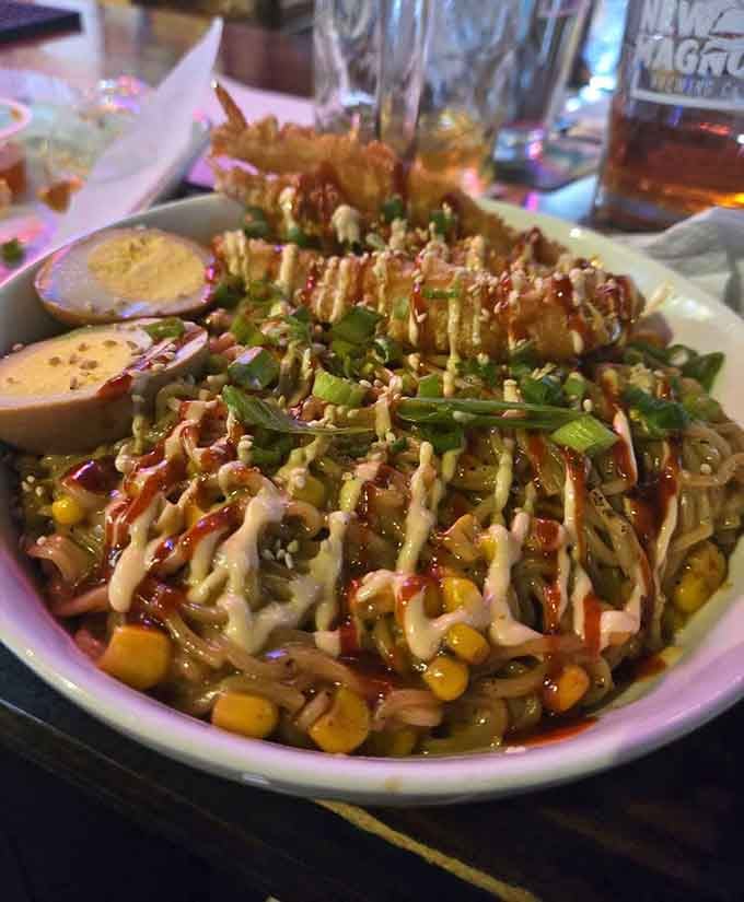 That drizzle game is strong, corn adds sweetness, and those noodles are ready for their close-up any day now.