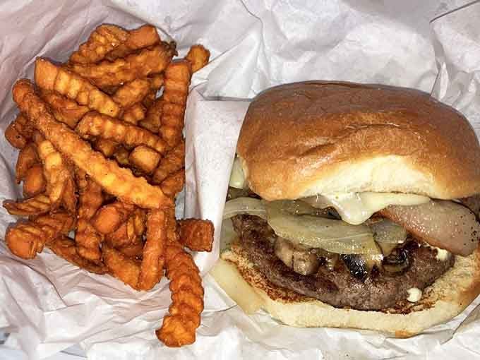 That blue cheese crumble topping transforms an already stellar burger into something that belongs in a food hall of fame.