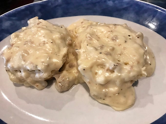 Biscuits drowning in creamy sausage gravy, the kind of Southern comfort that makes your taste buds stand up and salute.