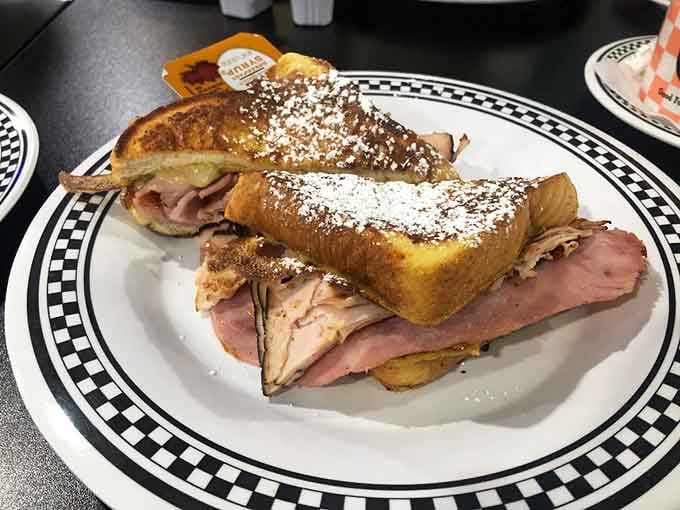 French toast stuffed with ham and dusted with powdered sugar: the sweet-savory combo your taste buds didn't know they needed.
