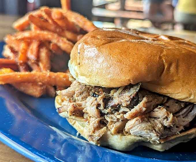 Pulled pork piled high on a bun, proving that sometimes the classics don't need improvement, just perfection.