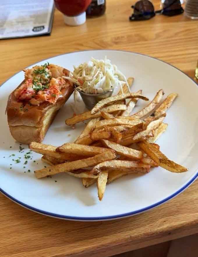The Lobster Roll arrives golden and generous, proving that sometimes simple preparations create the most memorable moments.