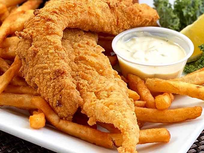 That cornmeal-crusted catfish with its mountain of fries is what food dreams are made of, friends.