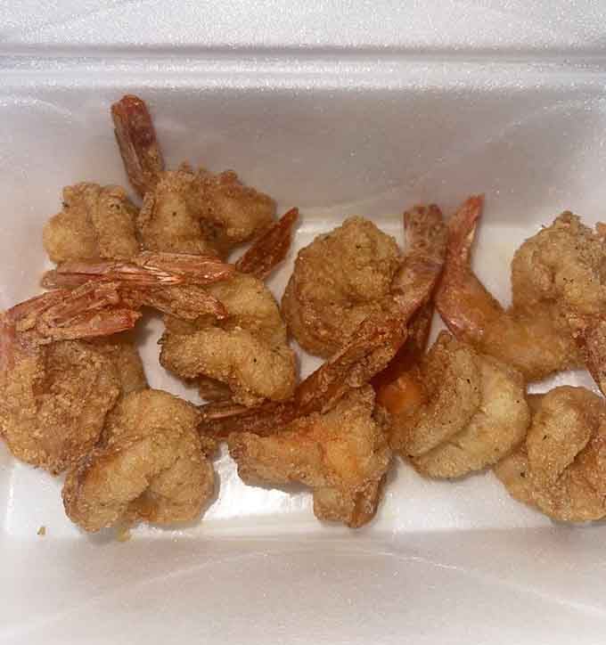 These fried shrimp wear their golden cornmeal coats like tiny crustacean royalty. Simple, unpretentious, and absolutely magnificent.
