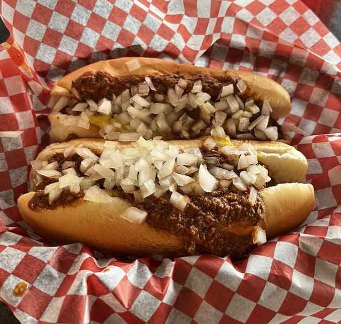 Two chili dogs loaded with savory goodness prove that sometimes simple perfection needs no fancy introduction.