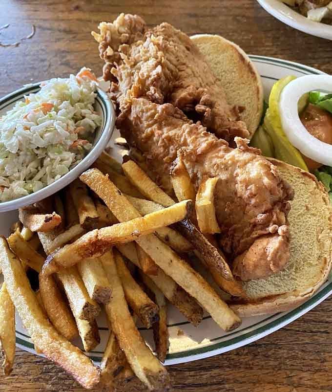 That pork tenderloin sandwich is so generously portioned, you might need an engineering degree to figure out the approach.