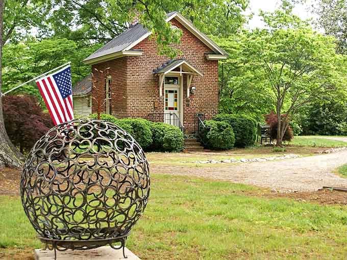 This charming brick schoolhouse with its artistic metal sphere sculpture embodies Martinsville's blend of history and creativity. American flag included, no extra charge.