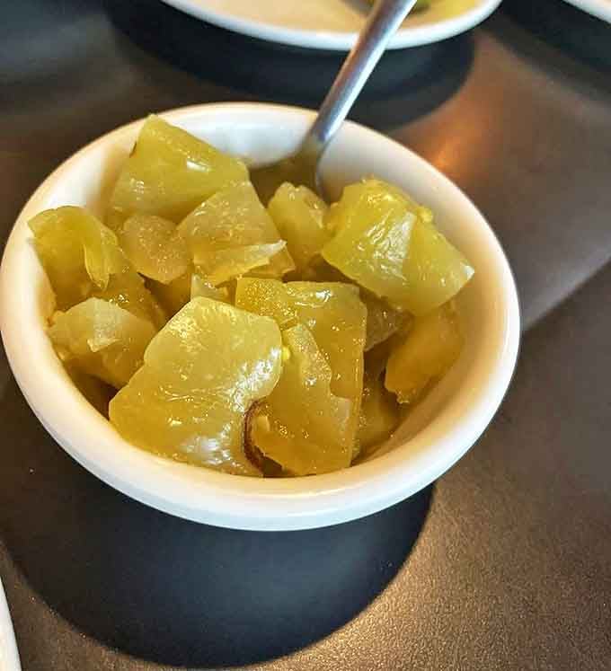 The pickled green tomato relish cuts through rich fried foods like a well-timed punchline&mdash;tangy, bright, and unexpectedly addictive.