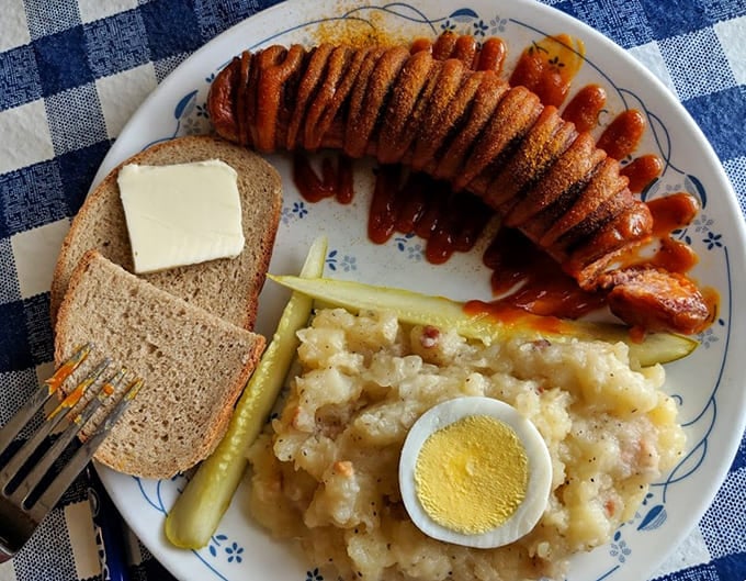 Bratwurst with all the fixings—this plate is basically a one-way ticket to Bavaria without the jet lag.