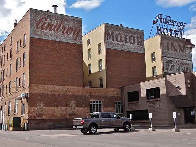 Faded ghost signs on brick walls tell stories of bustling commerce when iron ore made this town prosper.