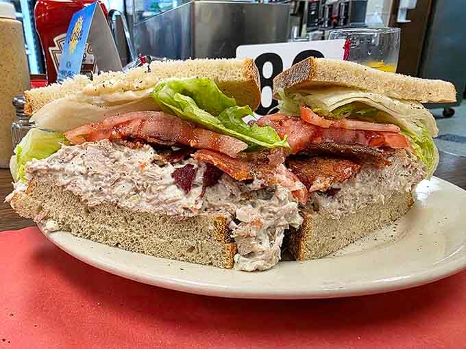 This triple-decker defies gravity and common sense, stacked higher than your uncle's fish stories at Thanksgiving.