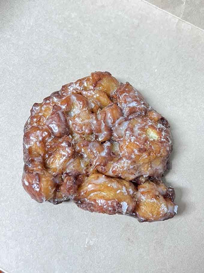 This apple fritter looks like it bench-presses other pastries, gloriously chunky and unapologetically delicious.