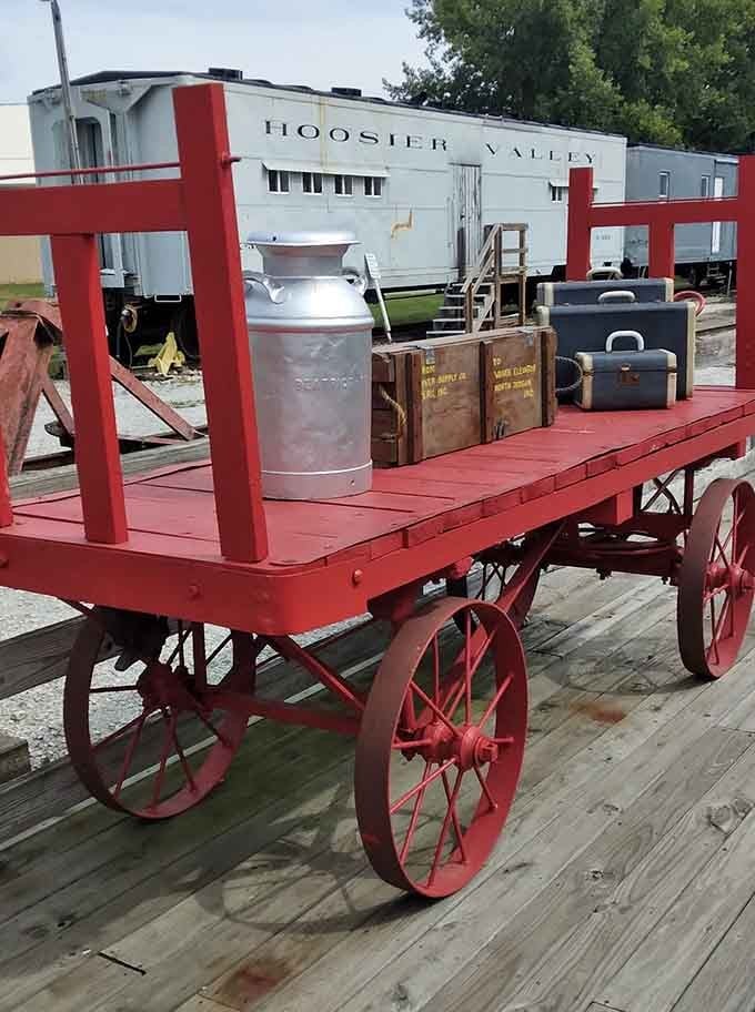 This bright red baggage cart isn't just for show &ndash; it's a functional piece of history loaded with vintage milk cans and travelers' trunks.