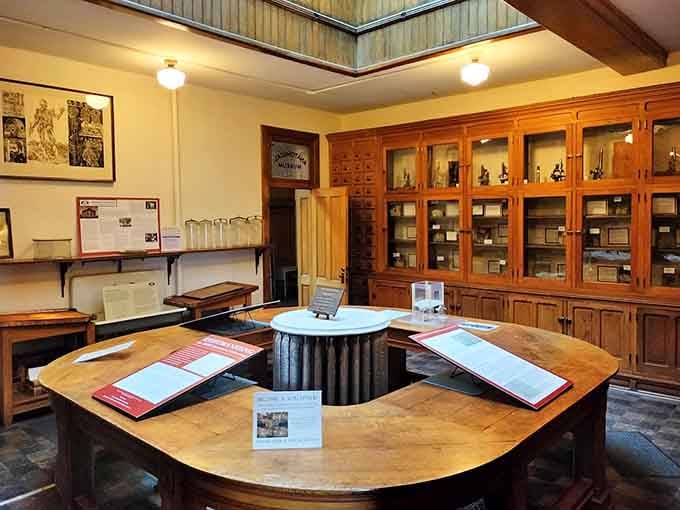 Medical texts and equipment arranged exactly as they were, minus the doctors who stepped out a century ago.