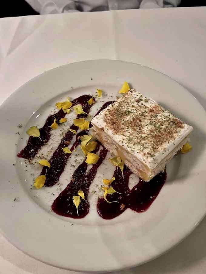 Key lime tiramisu with berry drizzle and edible flowers proves dessert can be both elegant and utterly irresistible simultaneously.