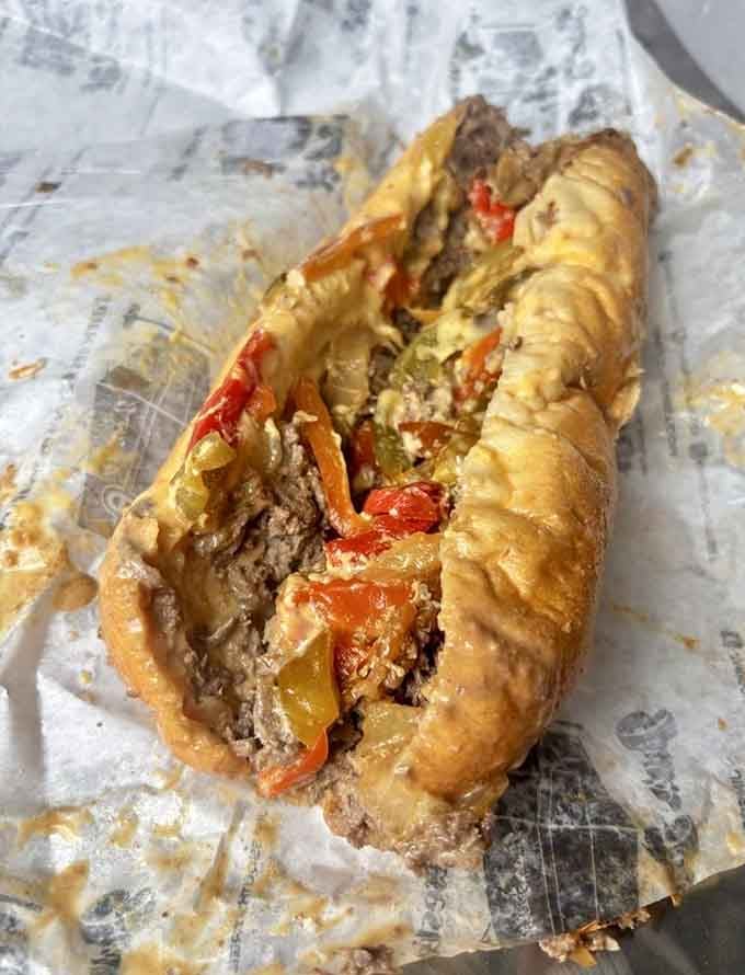 Melted cheese cascading over peppers creates a landscape more beautiful than any postcard you'll send home.