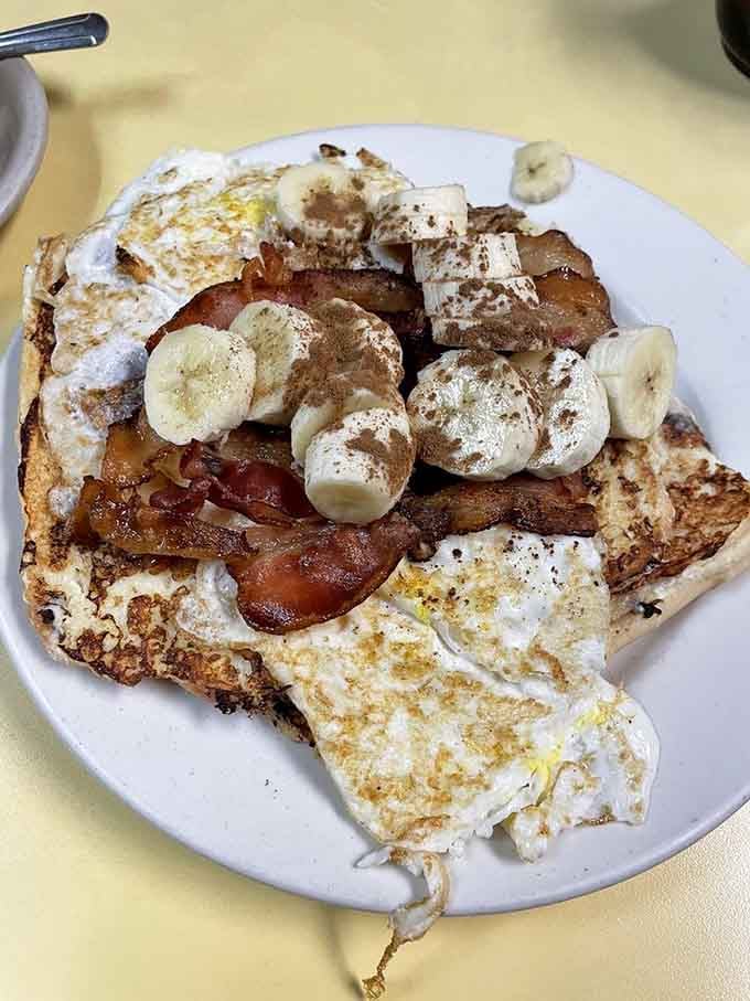 French toast thick enough to require architectural support, delicious enough to make you forget your own name.